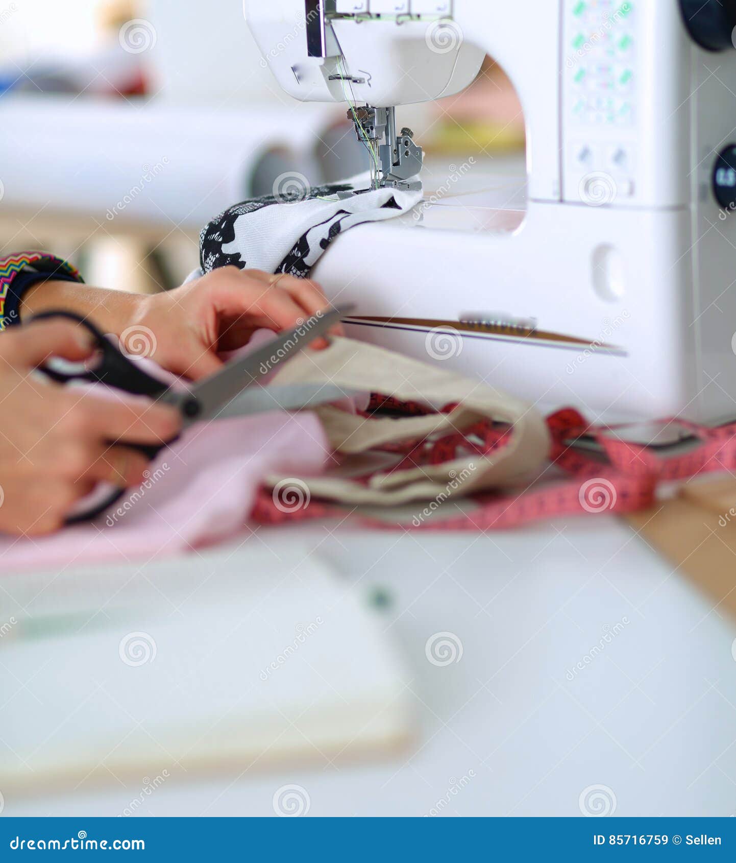 Young Woman Sewing while Sitting at Her Working Place Stock Image ...