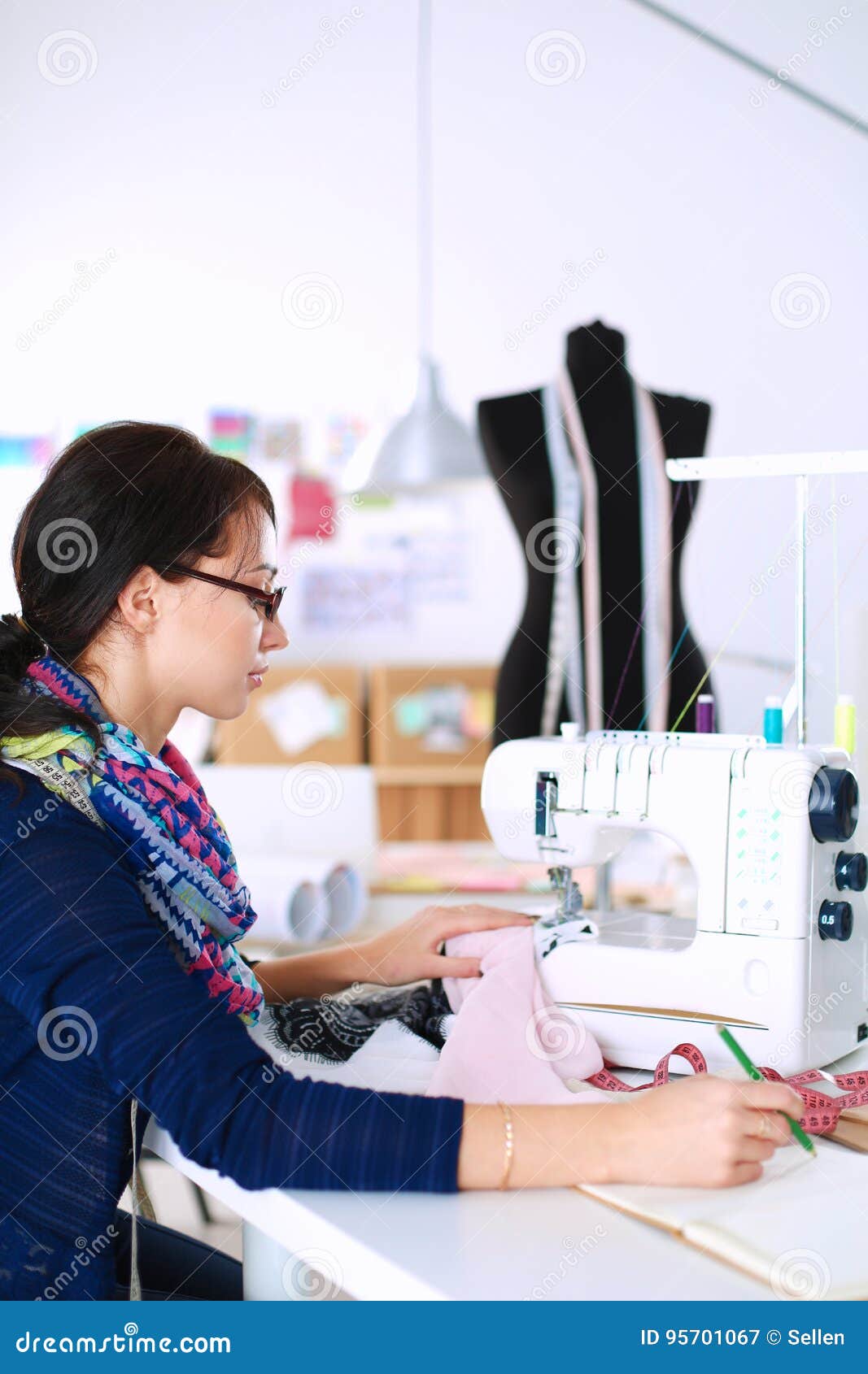 Young Woman Sewing while Sitting at Her Working Place . Stock Image ...