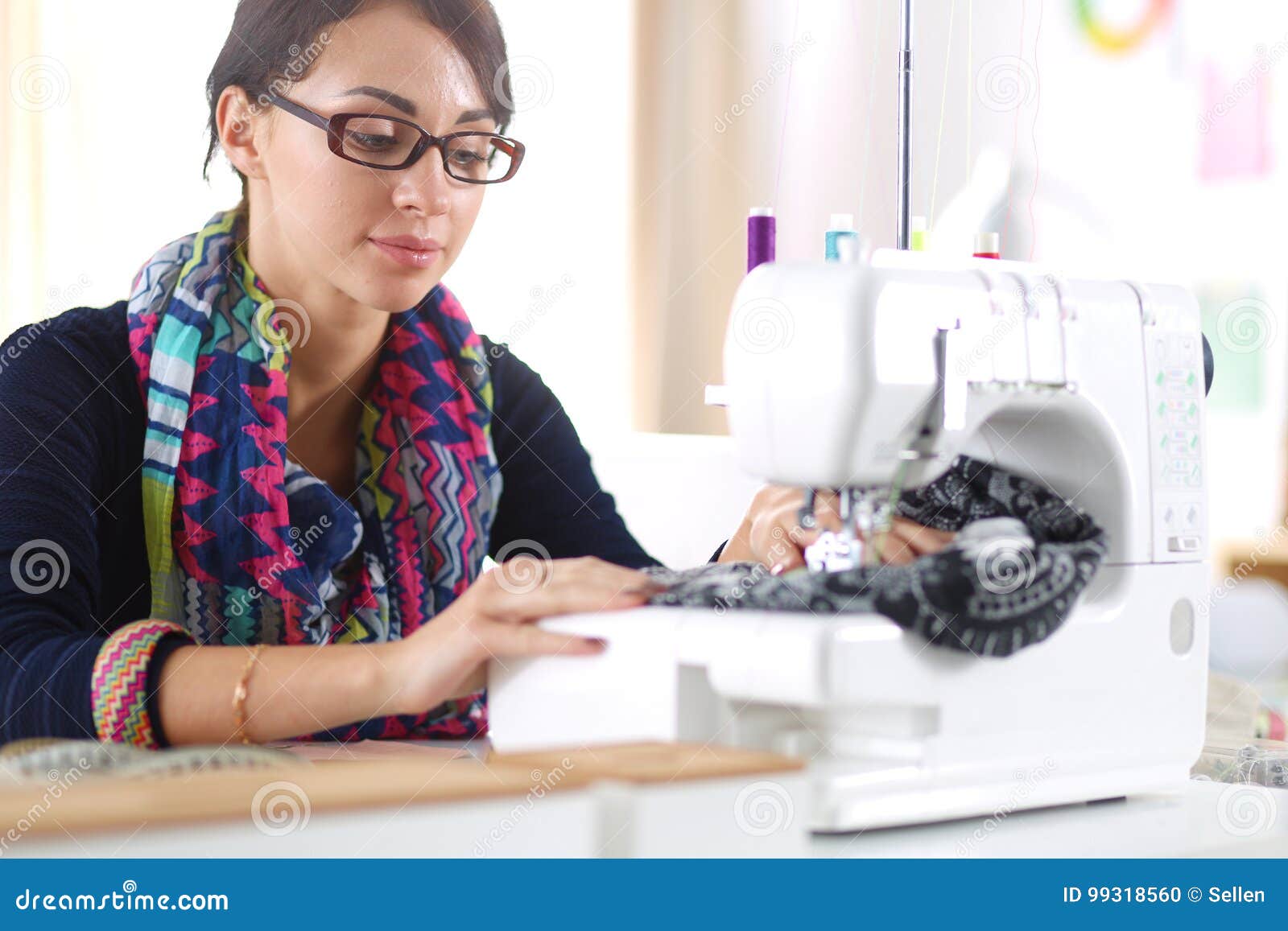 Young Woman Sewing while Sitting at Her Working Place . Stock Photo ...