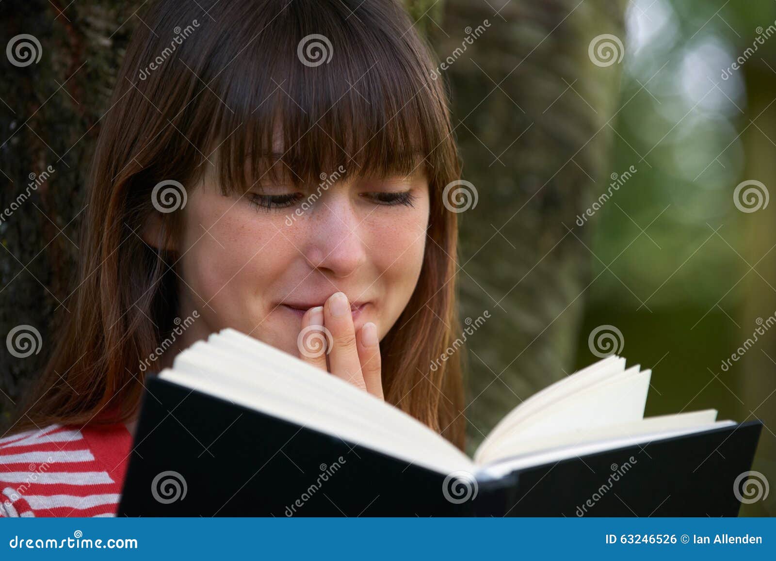 Young Woman Shocked by Reading Novel Outdoors Stock Photo - Image of ...