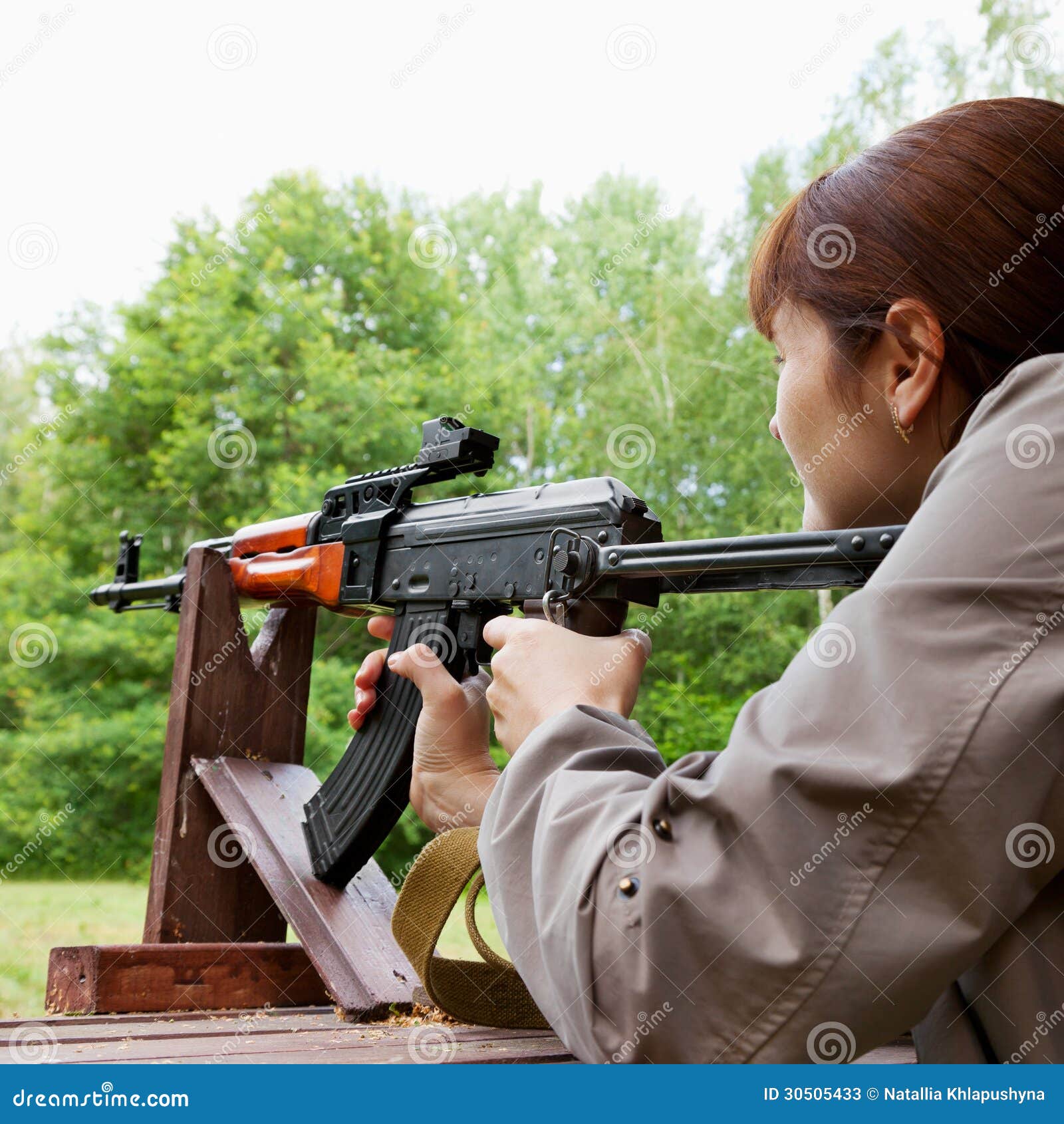 Young Woman Shooting an Automatic Rifle Stock Image - Image of hunter ...