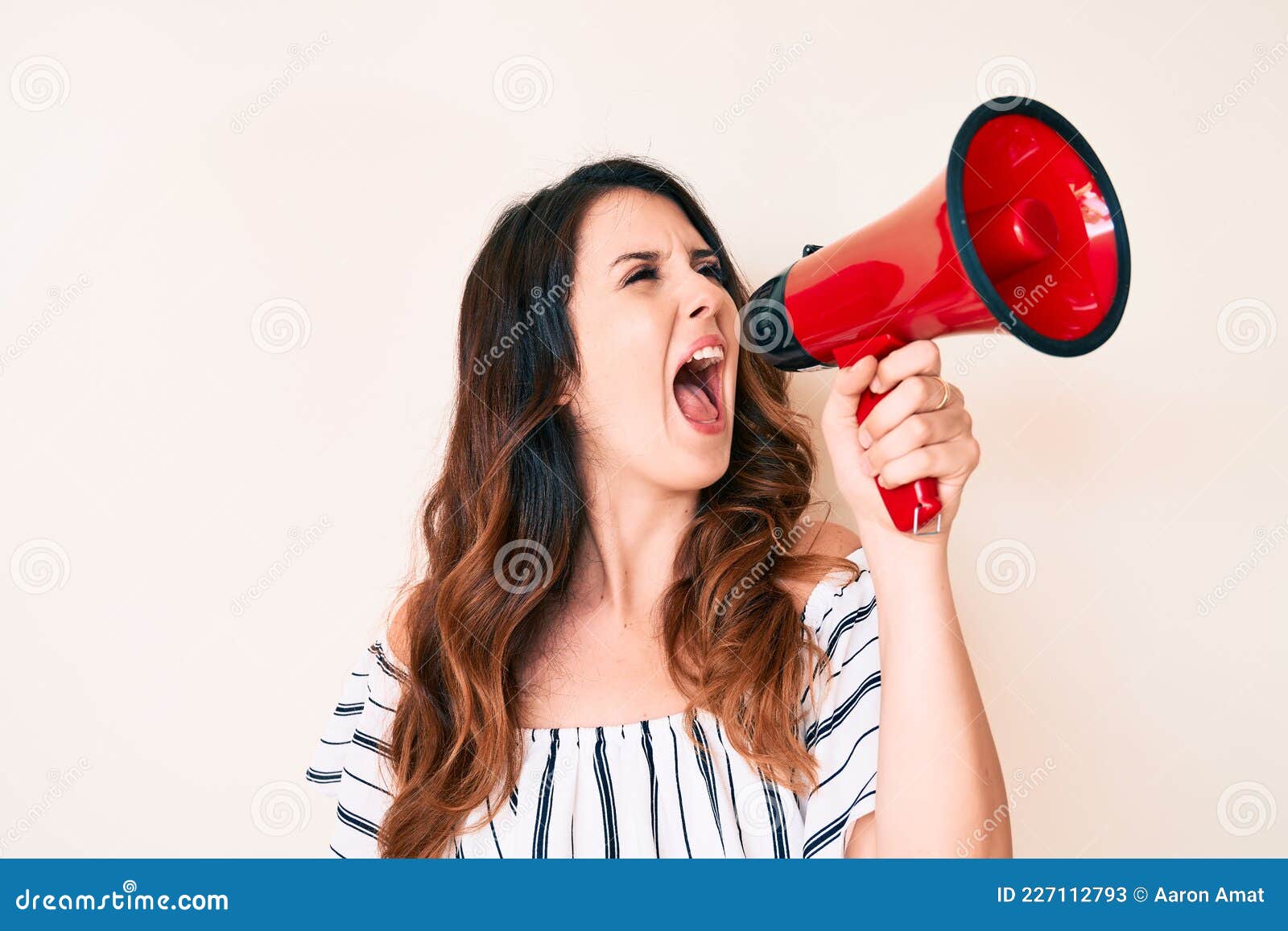 Young Woman Shouting Exited Throung Megaphone, Yelling and Screaming ...