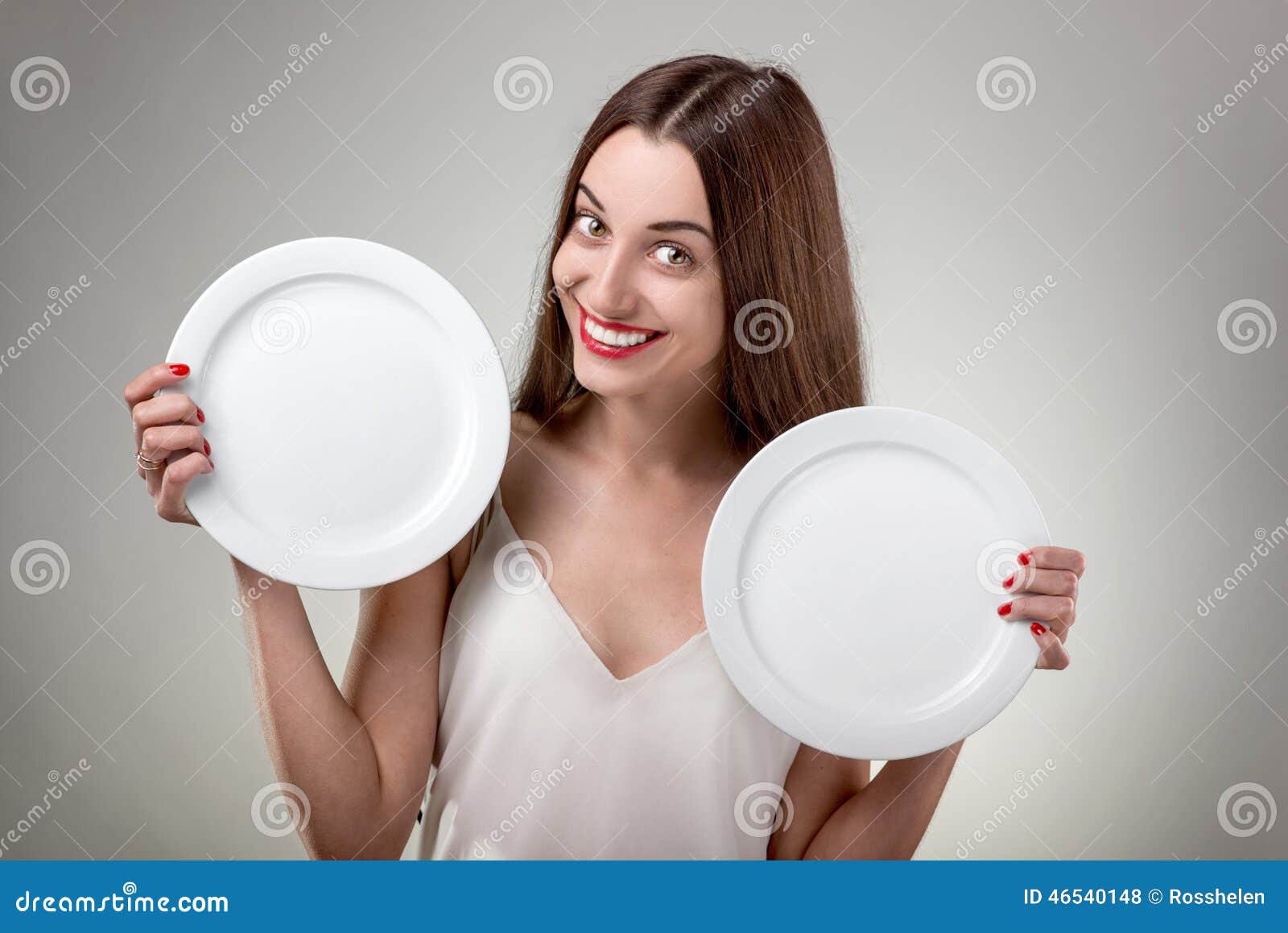 Young Woman Showing Empty Plates. Stock Photo - Image of copyspace ...