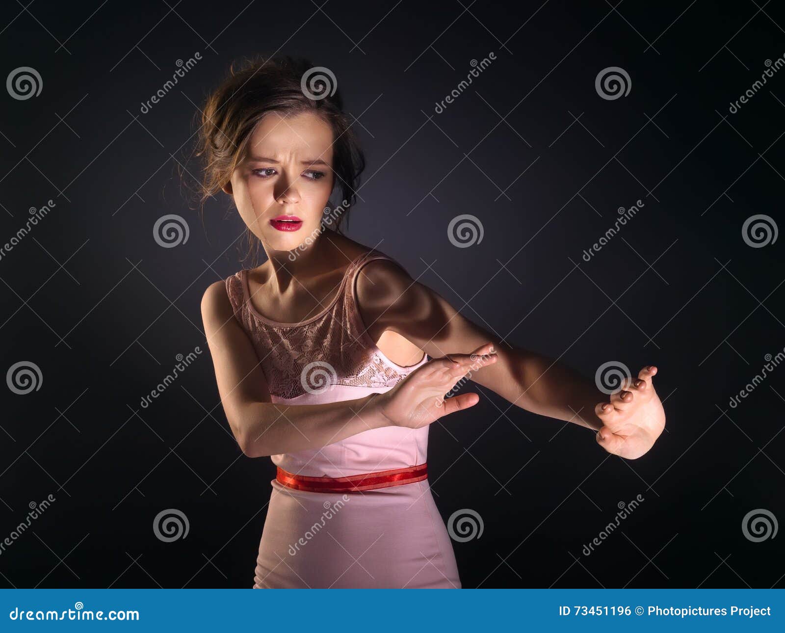 Young Woman Shying Away from the Light Stock Photo - Image of beautiful, black: 73451196