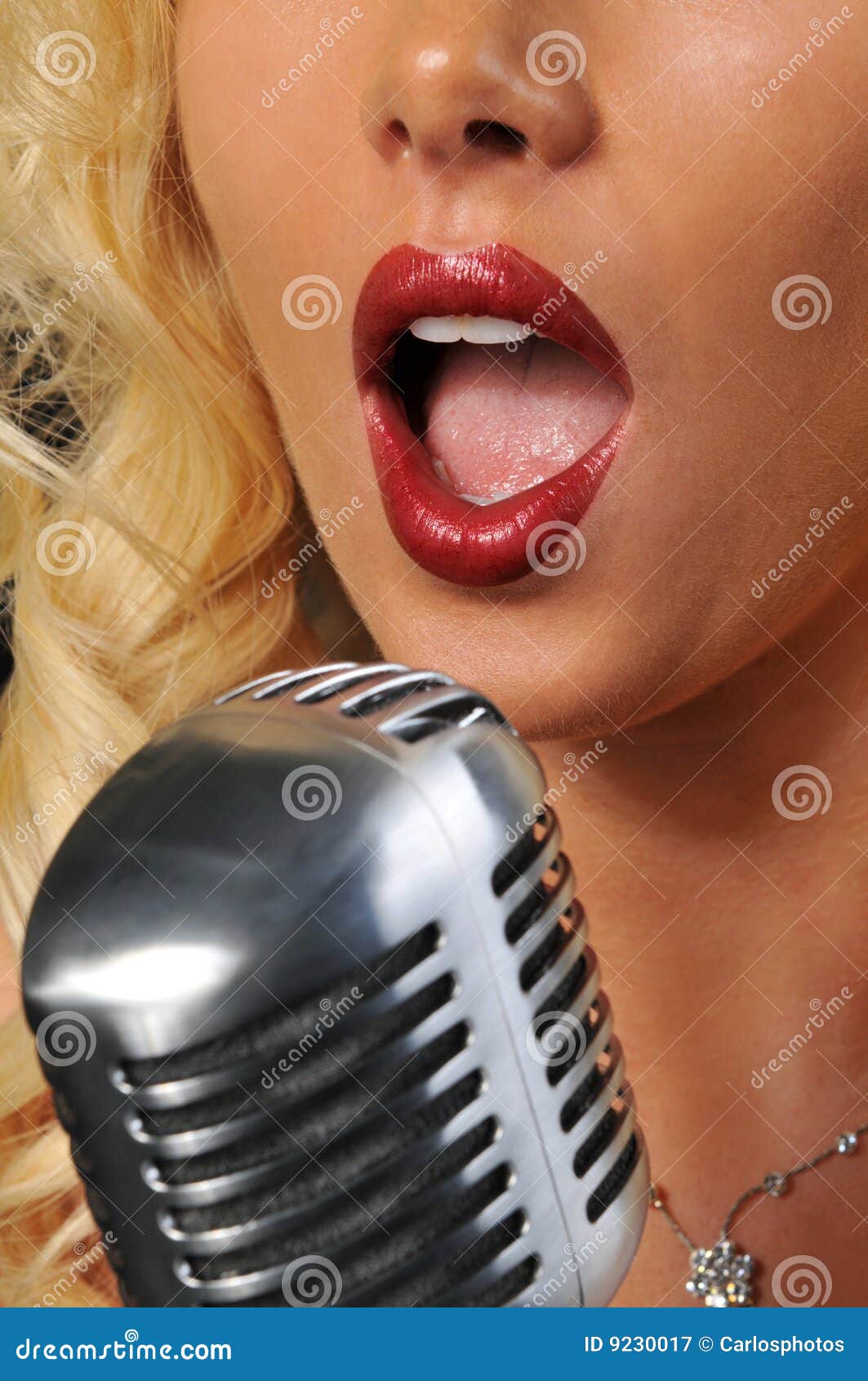 Young Woman Singing into a Microphone Editorial Photography - Image of ...
