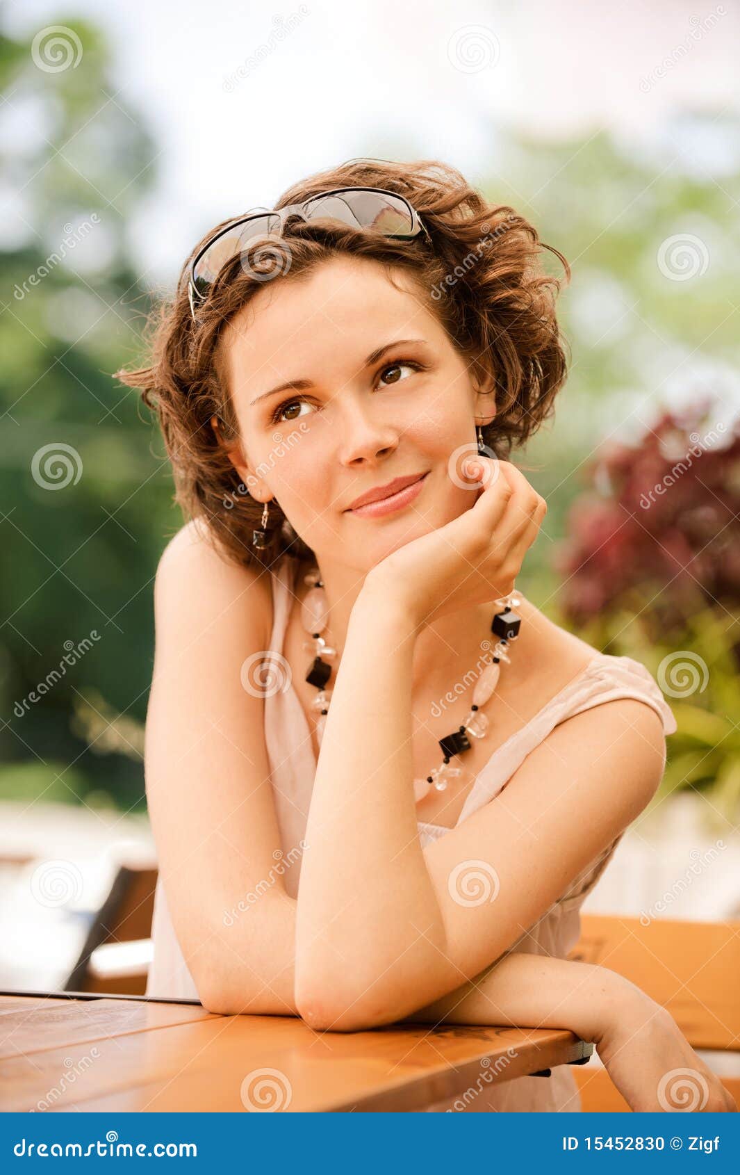 Young Woman Sits at Little Table Stock Photo - Image of cafe, outside ...