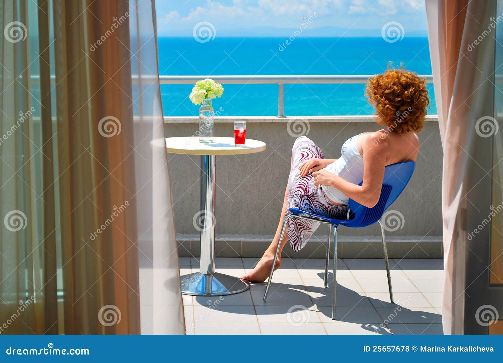 Young Woman Sitting on the Balcony at the See Stock Photo - Image of ...