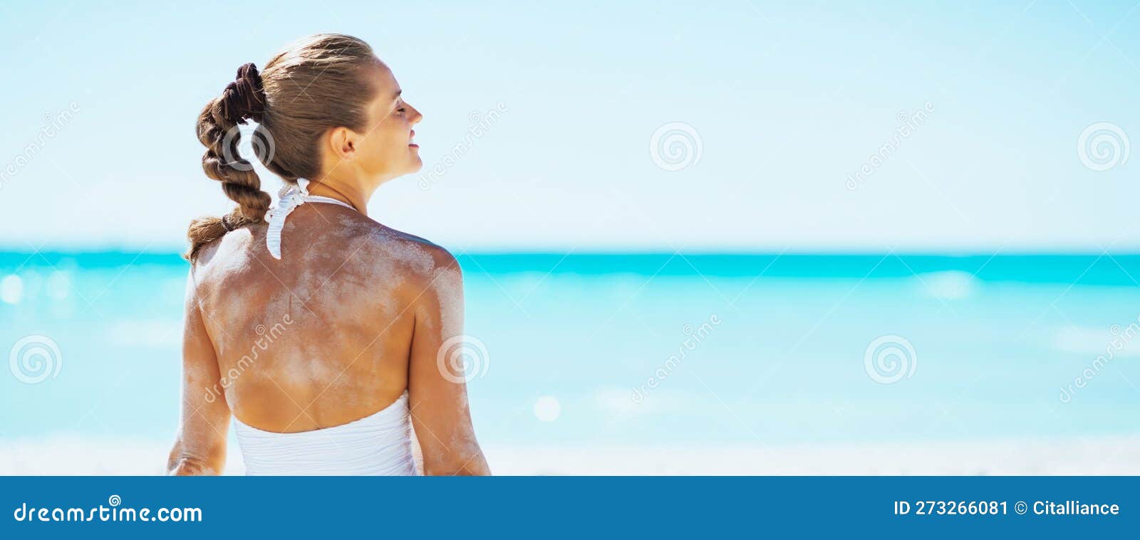 Young Woman Sitting on Beach. Rear View Stock Image - Image of ...