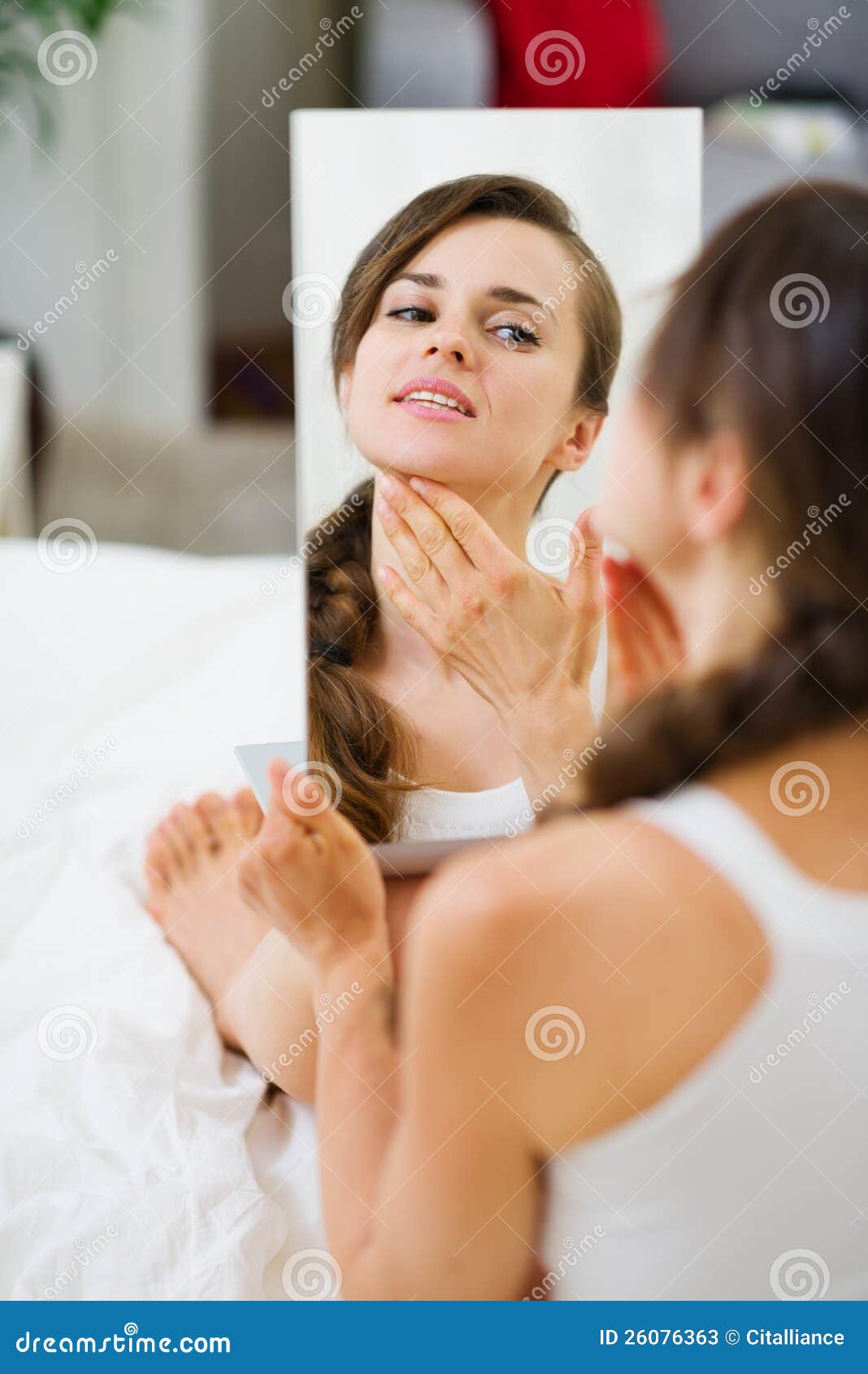 Young Woman Sitting on Bed and Looking on Mirror Stock Image - Image of ...