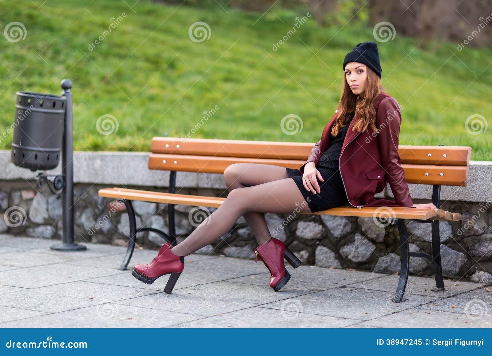 Young Woman Sitting on a Bench. Stock Image - Image of bench, green ...