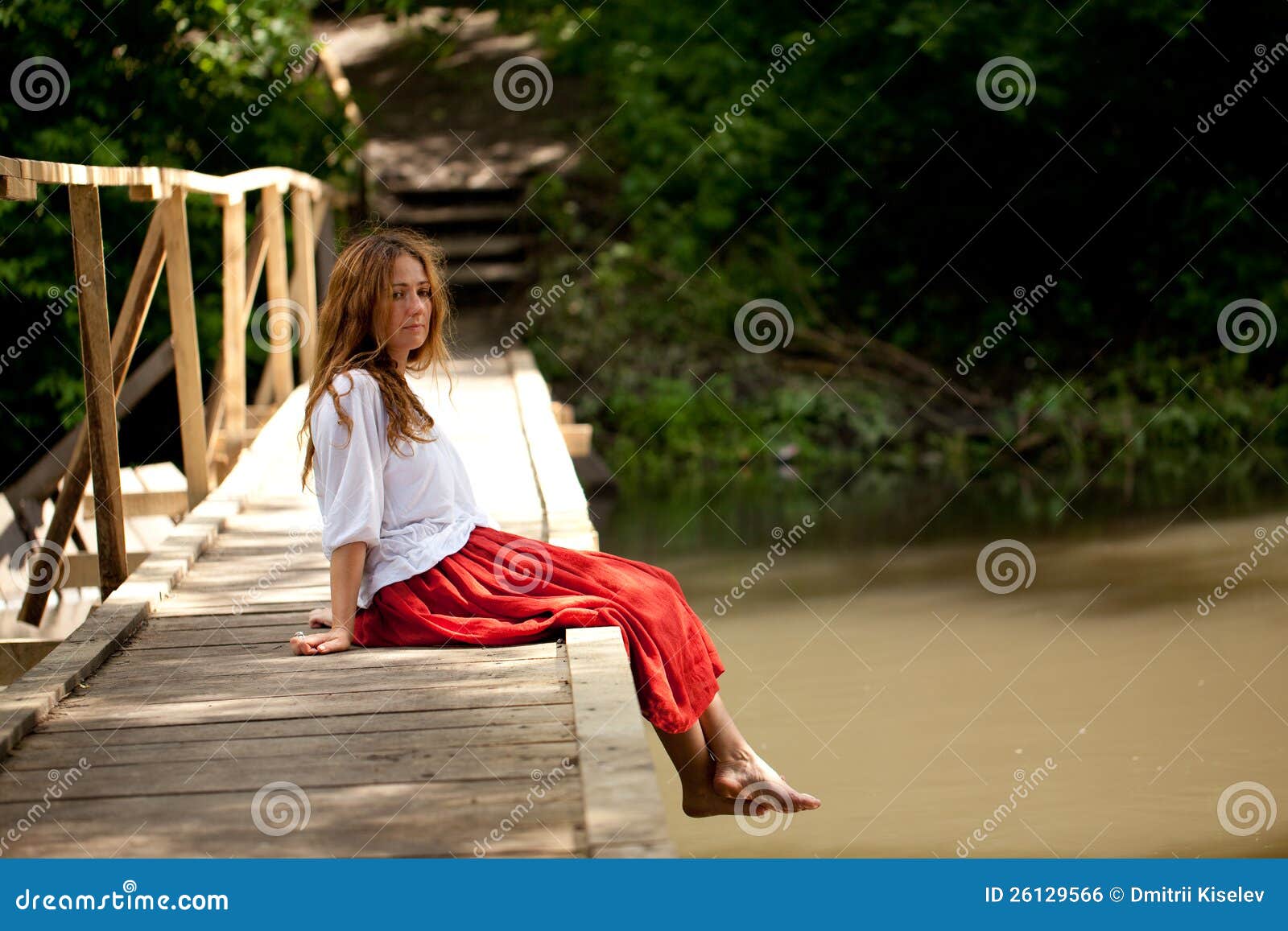 Young Woman Sitting on the Bridge Stock Photo - Image of bridgework ...