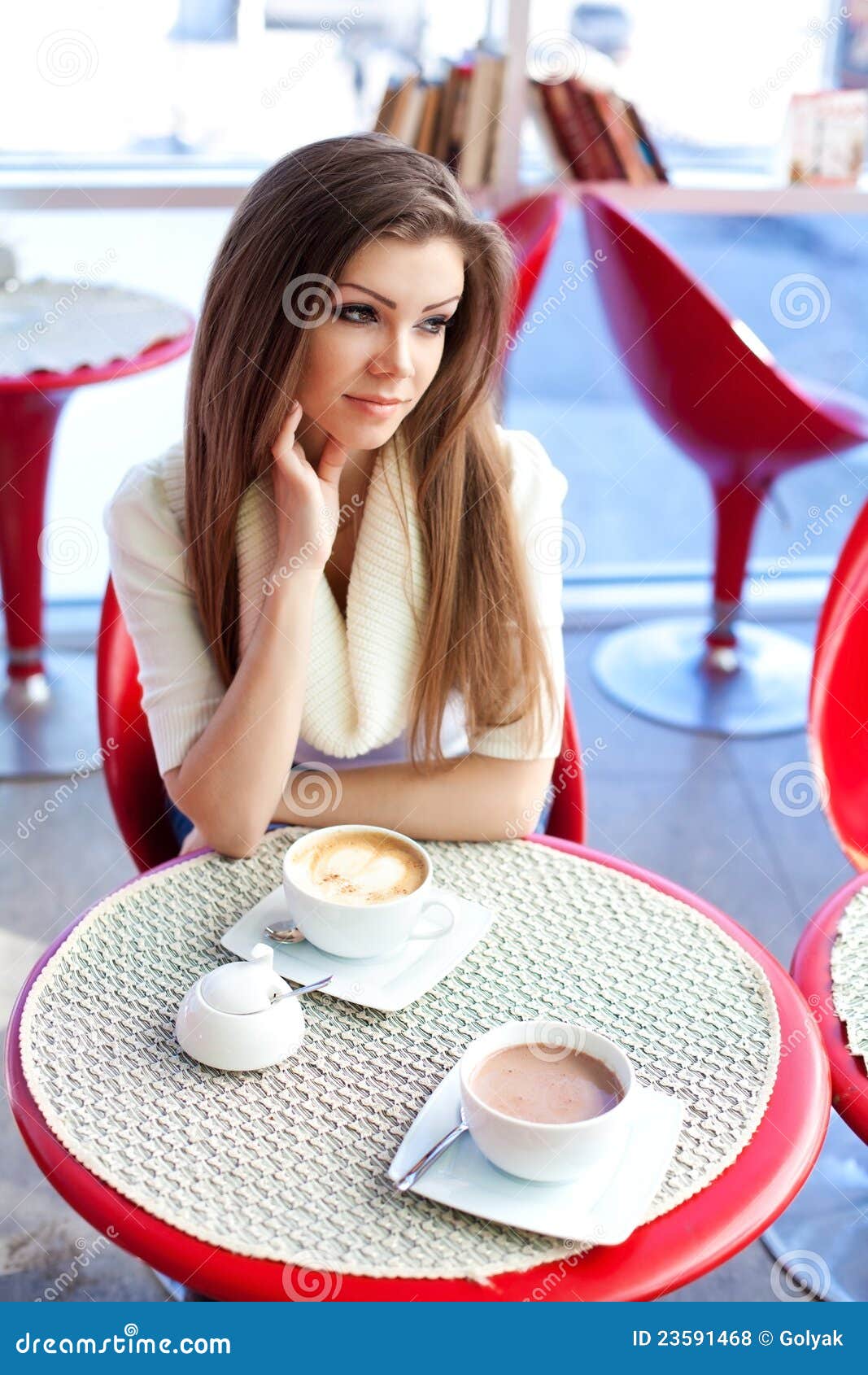 Young Woman Sitting in the Cafe with a Cup of Tea Stock Photo - Image ...