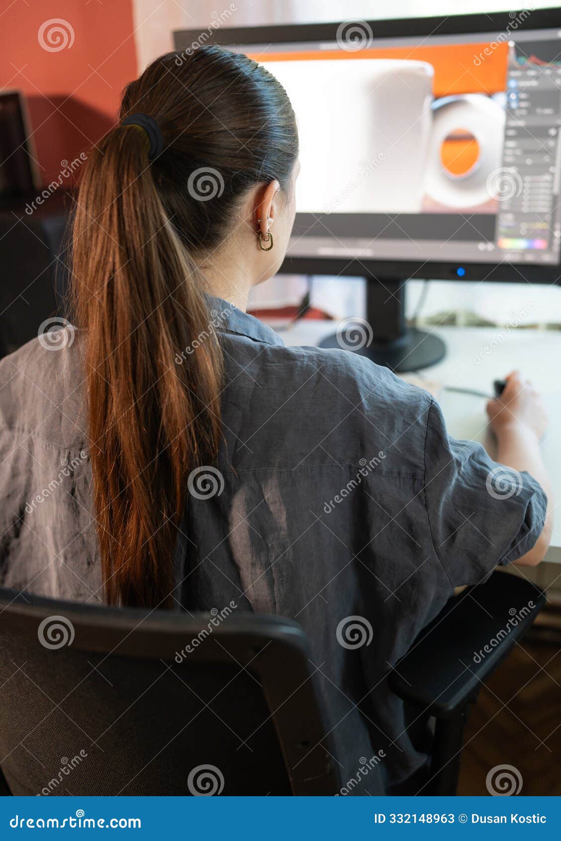 A Young Woman is Sitting at a Computer in the Office Stock Image ...