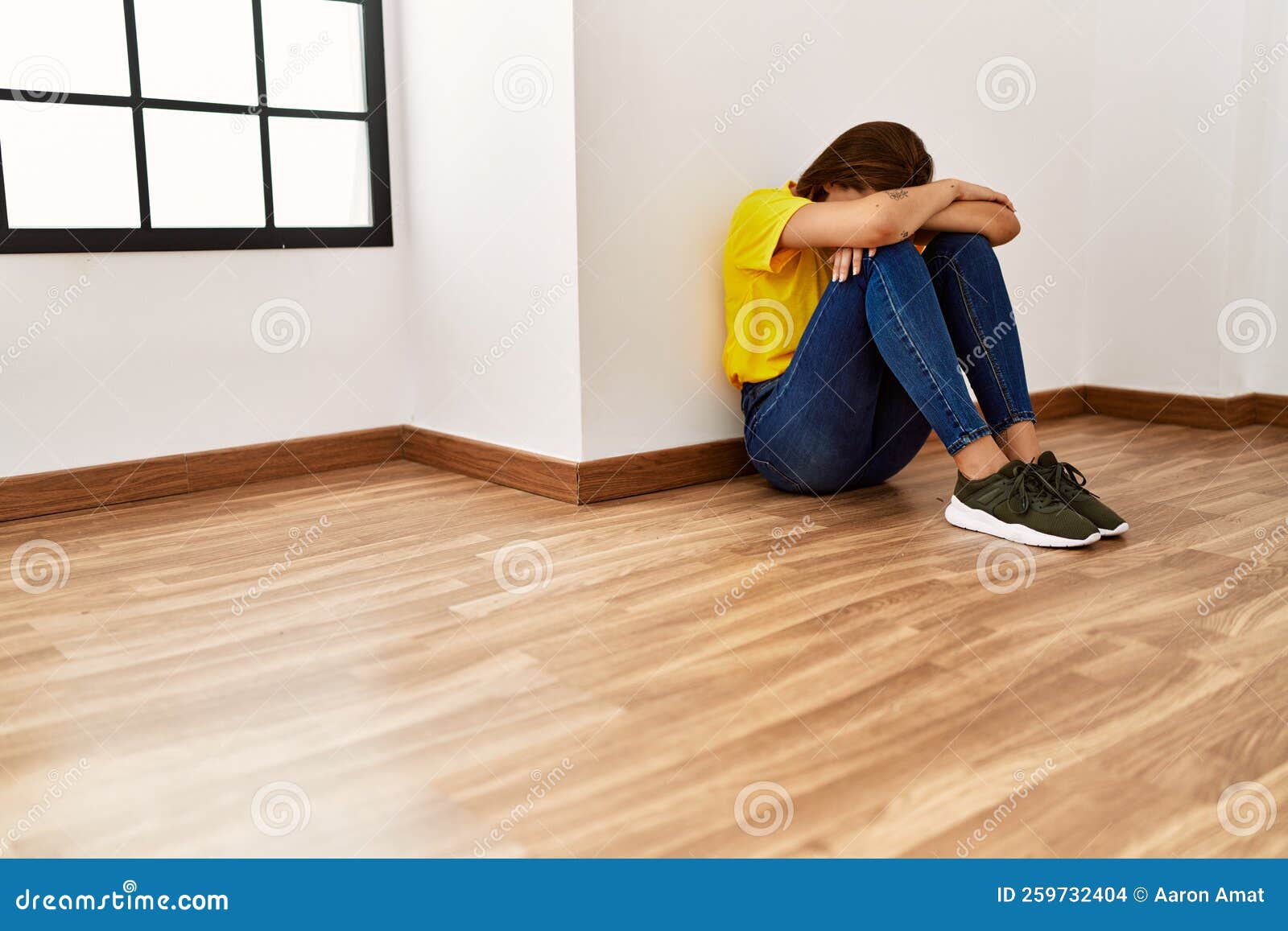 Young Woman Sitting on Floor Crying at Empty Room Stock Photo - Image ...