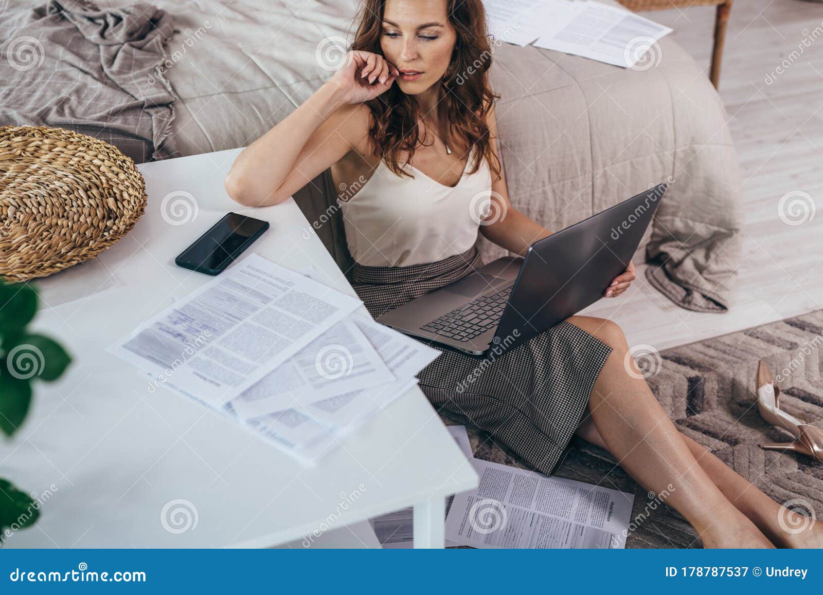 Young Woman is Sitting on the Floor with Notebook among Documents Stock ...