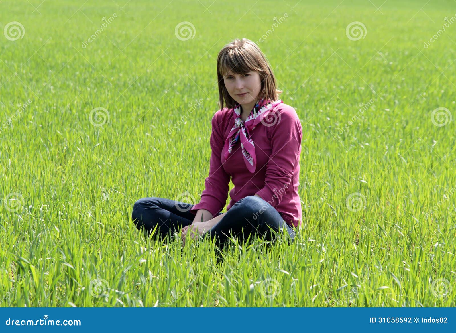 Young Woman Sitting on Grass Stock Photo - Image of adult, outdoor ...
