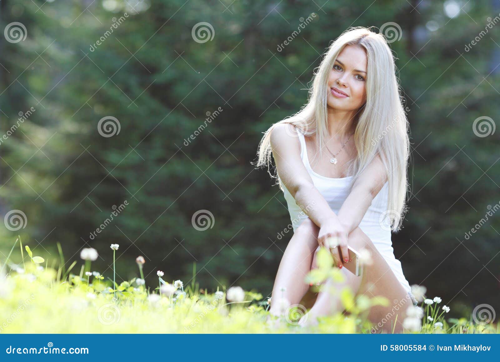 Young Woman Sitting on Grass Stock Photo - Image of happiness, sitting ...