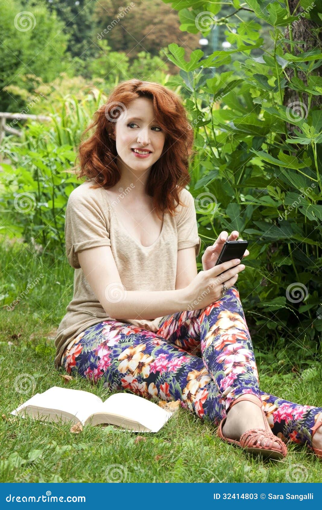 Young Woman Sitting on Grass Stock Image - Image of beauty, carefree ...