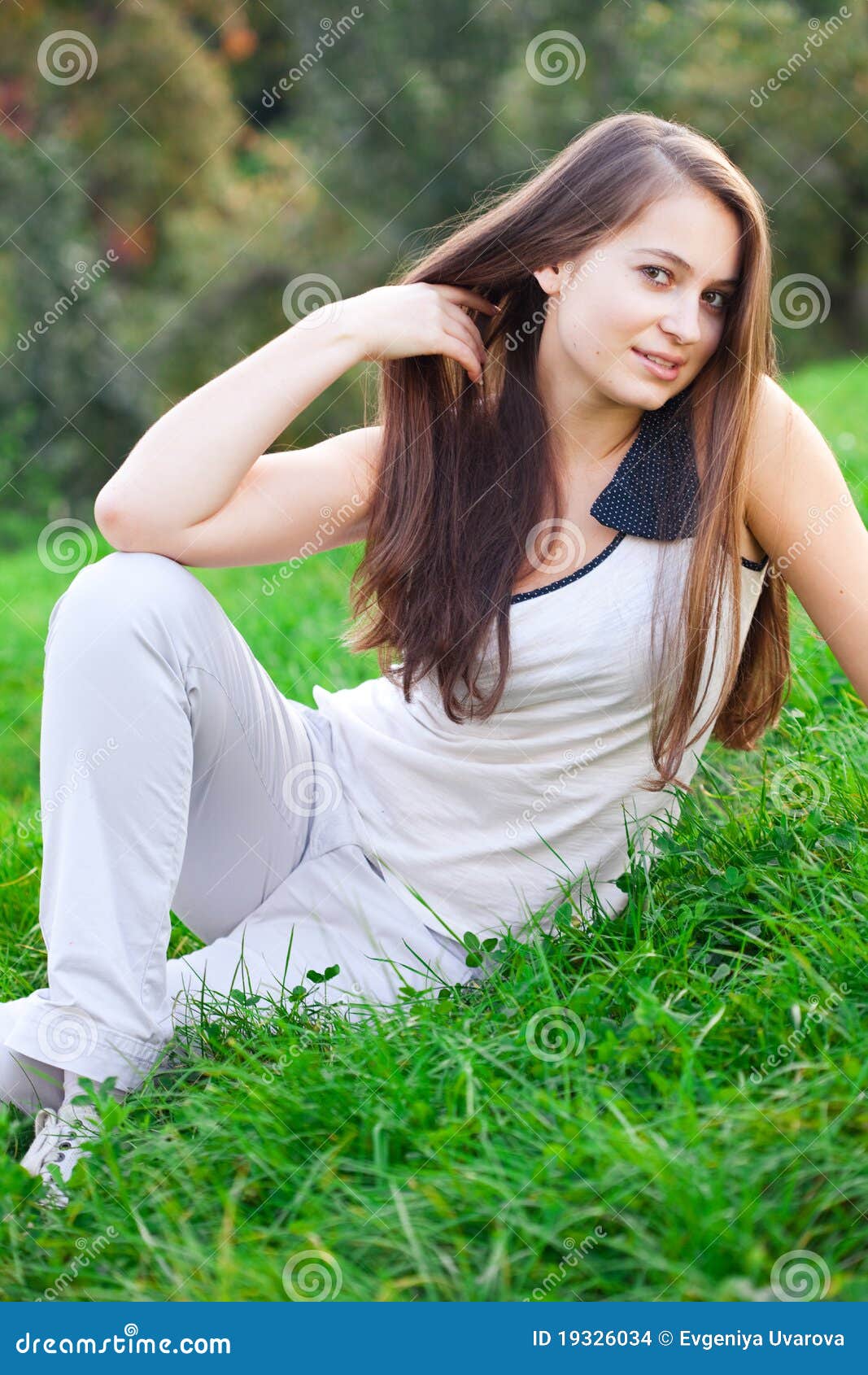 Young Woman Sitting on Green Grass Stock Photo - Image of looking ...