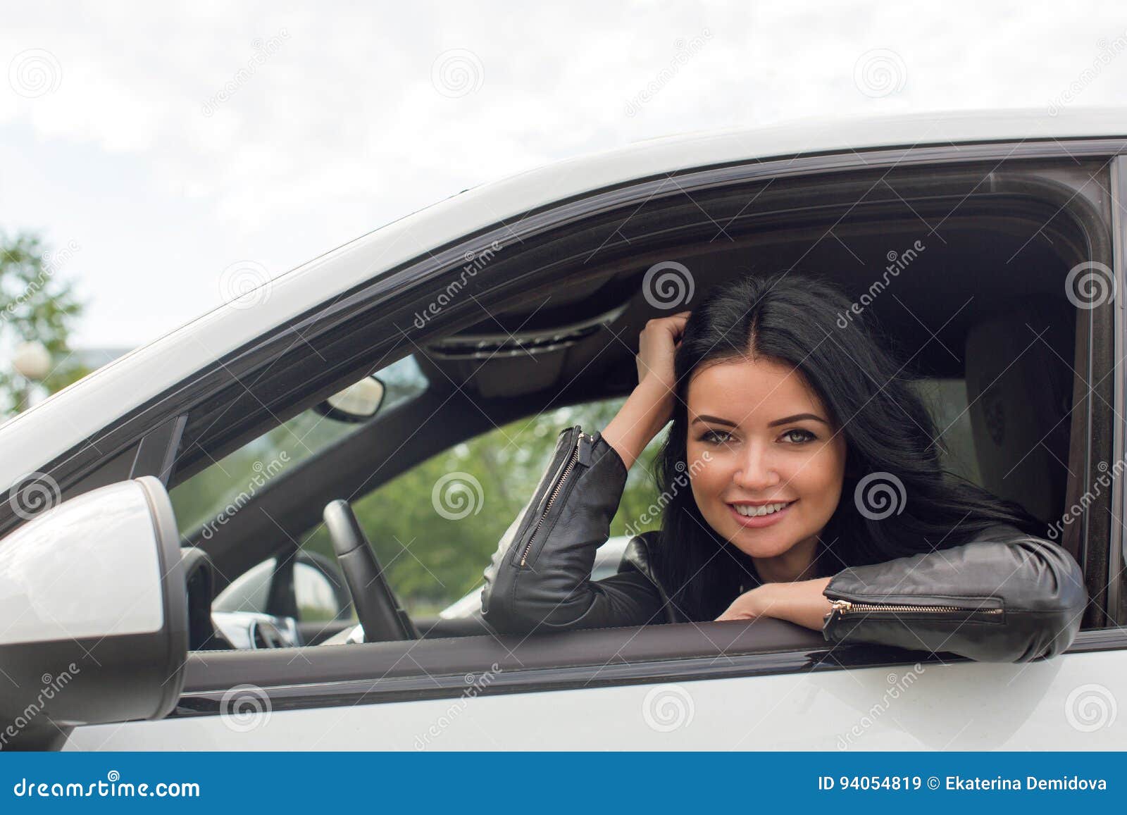 Young Woman Sitting Inside Car Smiling at Camera Stock Image - Image of ...