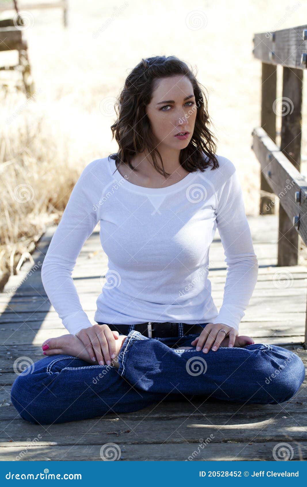 Young Woman Sitting Outdoors with Angry Expression Stock Photo - Image ...