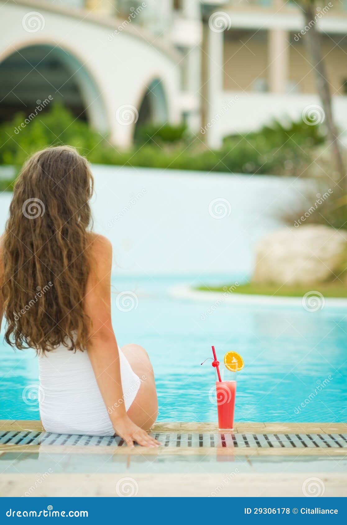 Young Woman Sitting at Poolside with Cocktail Stock Photo - Image of ...