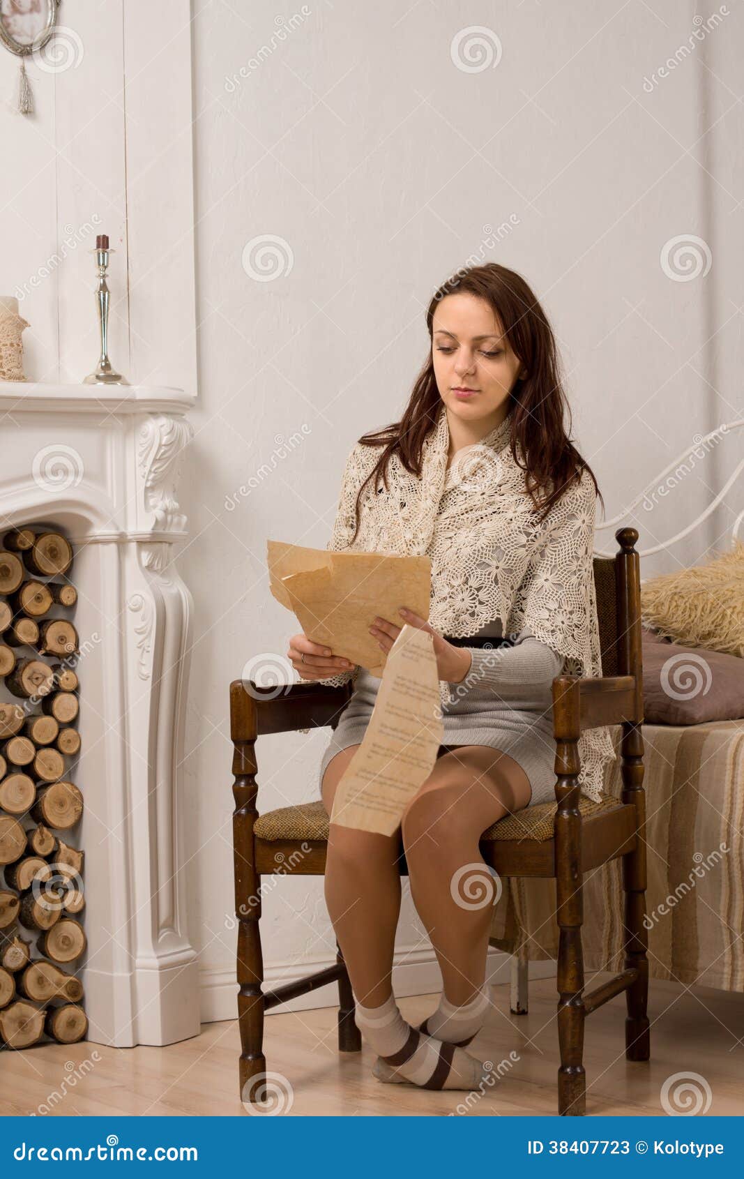 Young Woman Sitting Reading a Long Document Stock Image - Image of ...