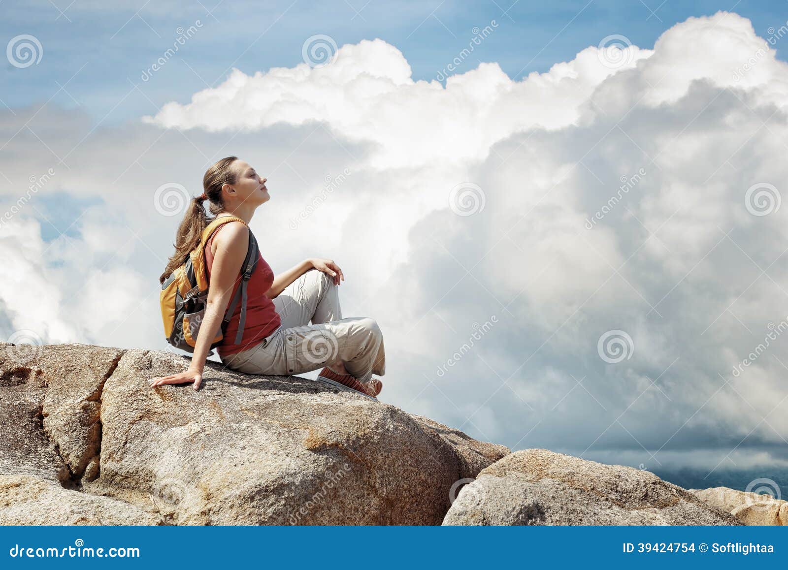 Young Woman Sitting on a Rock with Backpack. Stock Photo - Image of ...