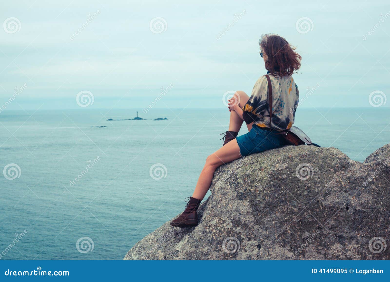 Young Woman Sitting on a Rock by the Sea Stock Image - Image of woman ...