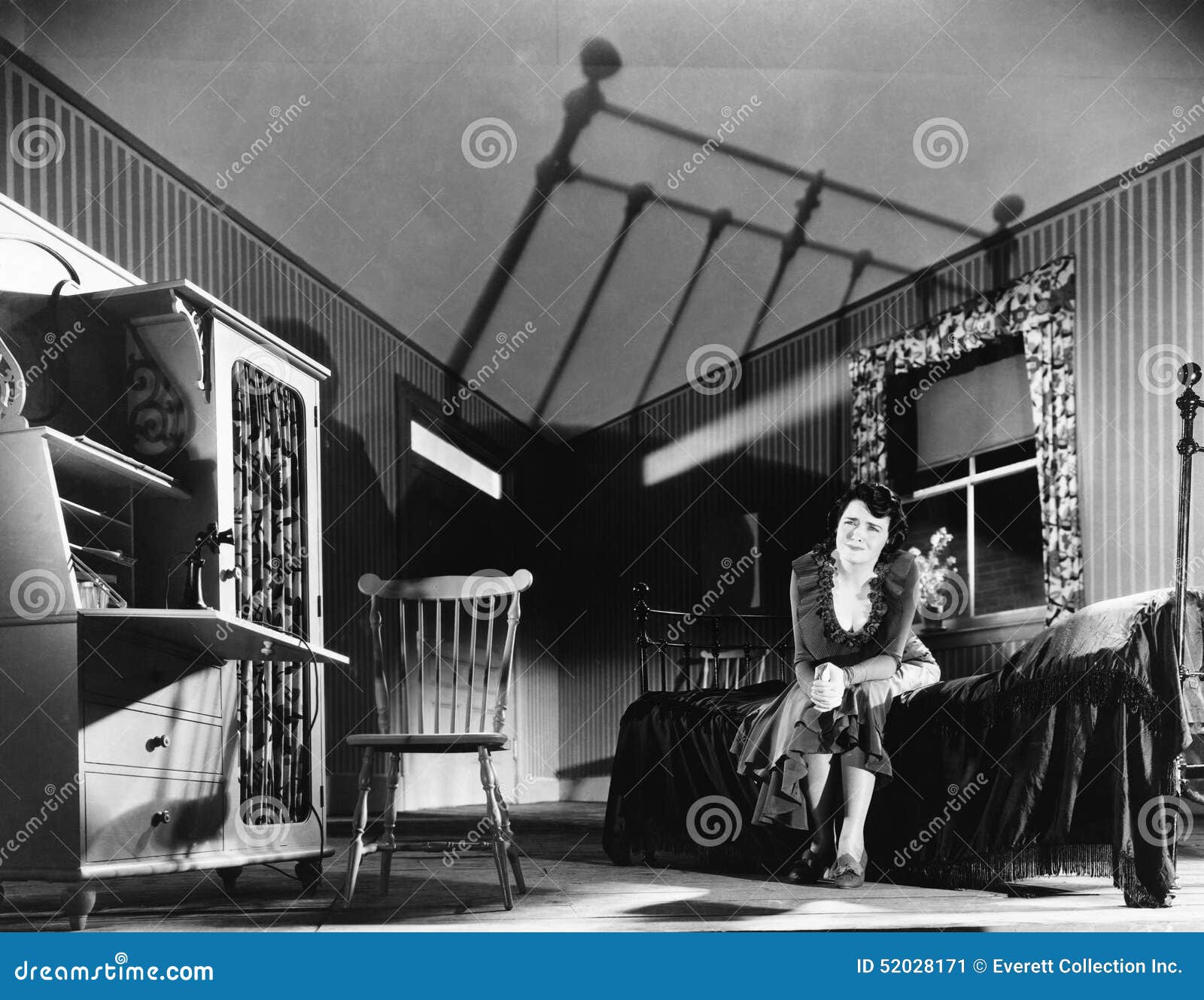 Young Woman Sitting in a Room Looking Scared Stock Image - Image of ...