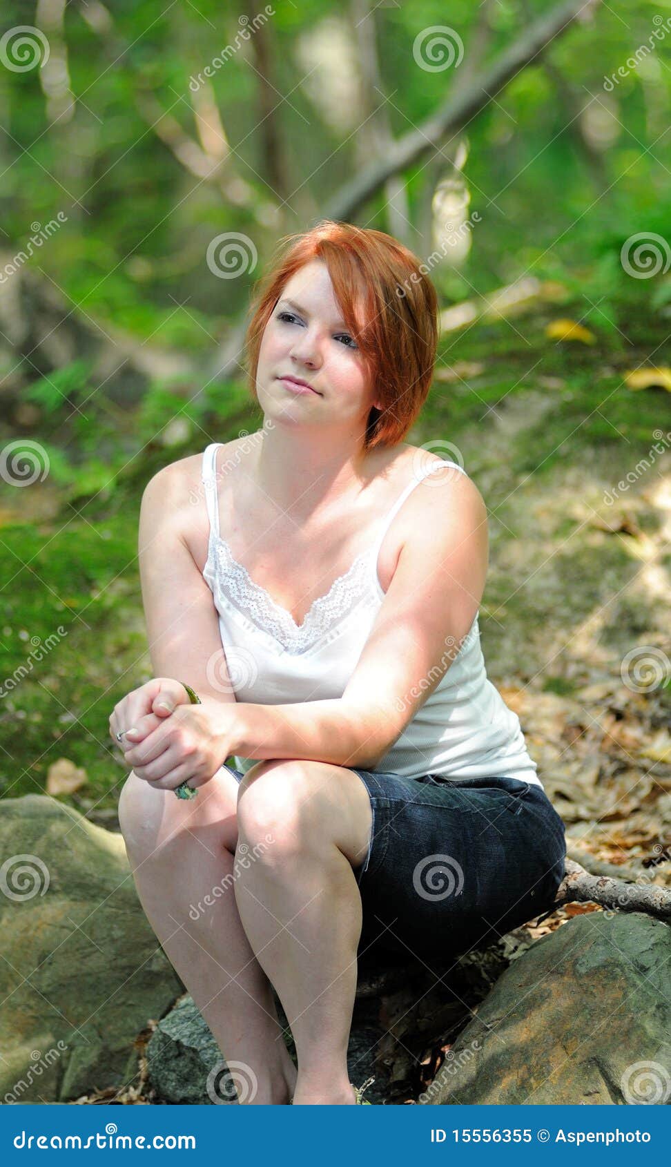 Young Woman Sitting in Shadows - Woods Stock Image - Image of girl ...