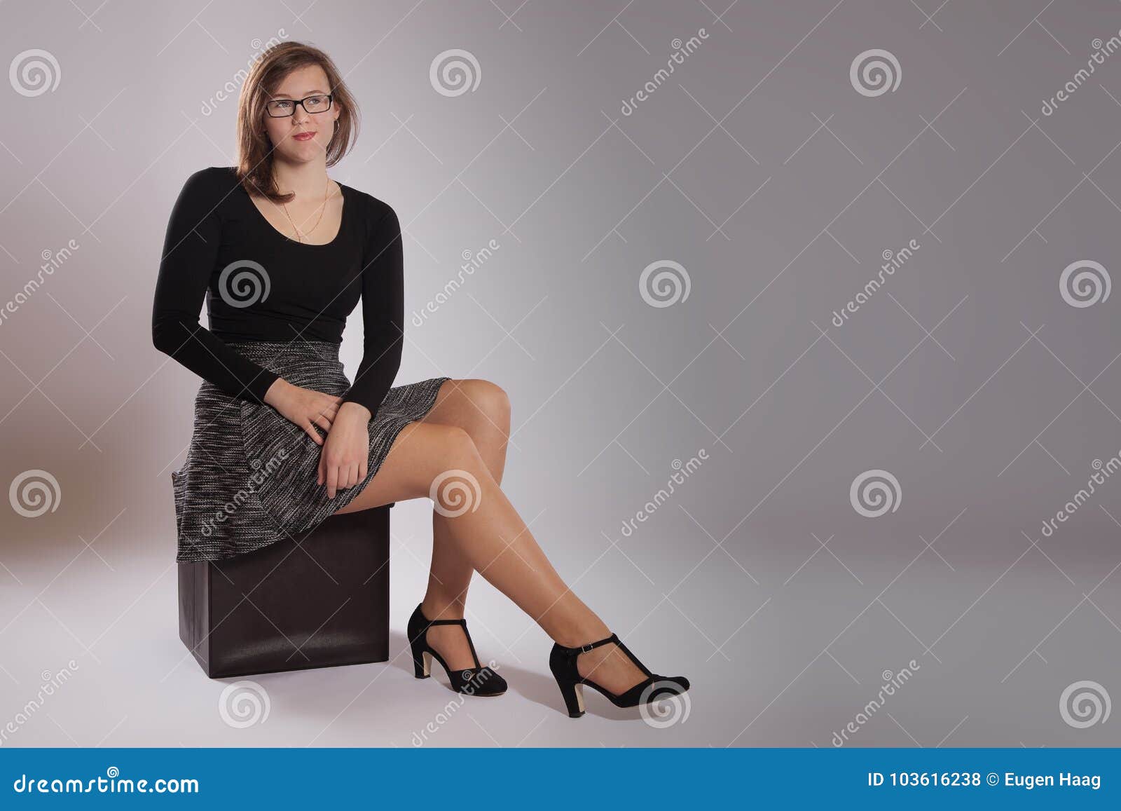 Young Woman is Sitting on a Stool Stock Photo - Image of jacket, adult ...