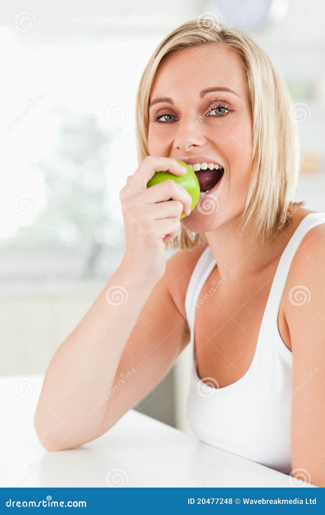 Young Woman Sitting at Table Eating Stock Photo - Image of glass ...