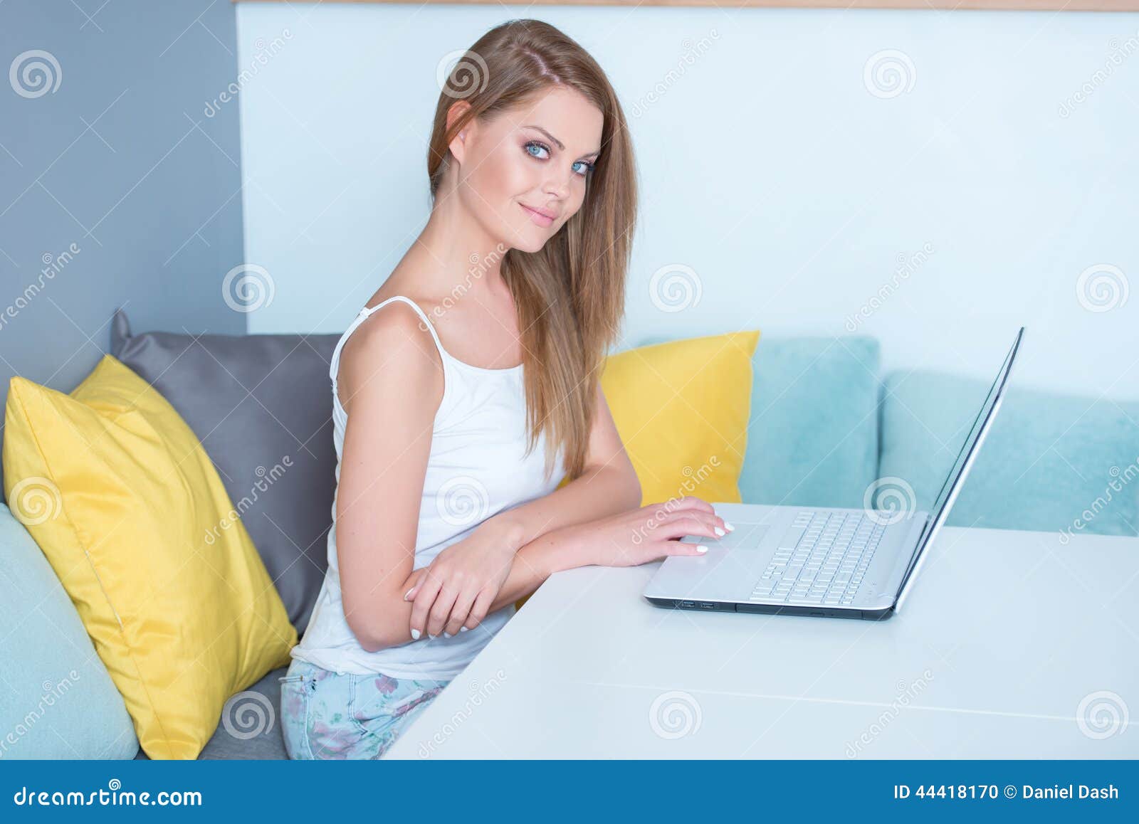 Young Woman Sitting at Table with Laptop Computer Stock Photo - Image ...