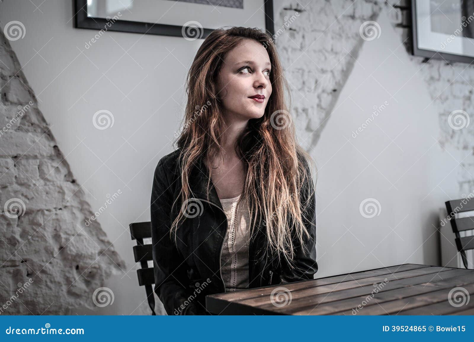 Young Woman Sitting at a Table Waiting Stock Image - Image of beautiful ...