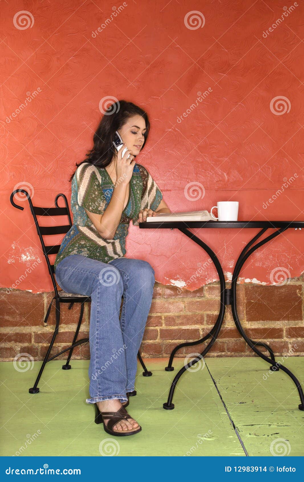 Young Woman Sitting and Talking on Cellphone Stock Photo - Image of ...