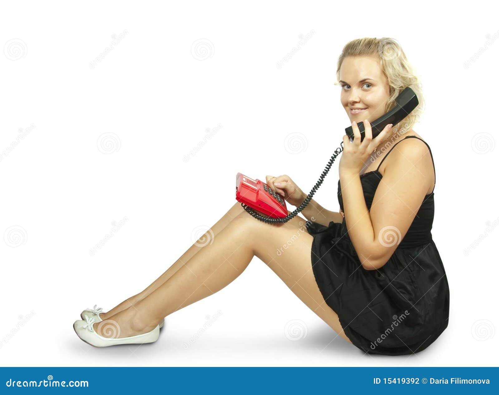 Young Woman Sitting and Talking on Phone Stock Photo - Image of ...