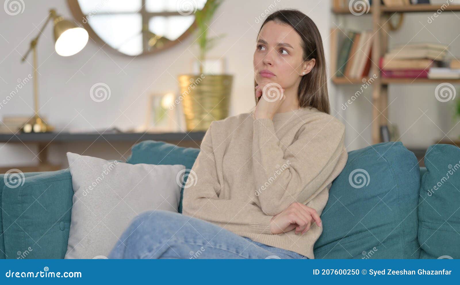 Young Woman Sitting and Thinking on Sofa Stock Photo - Image of working ...