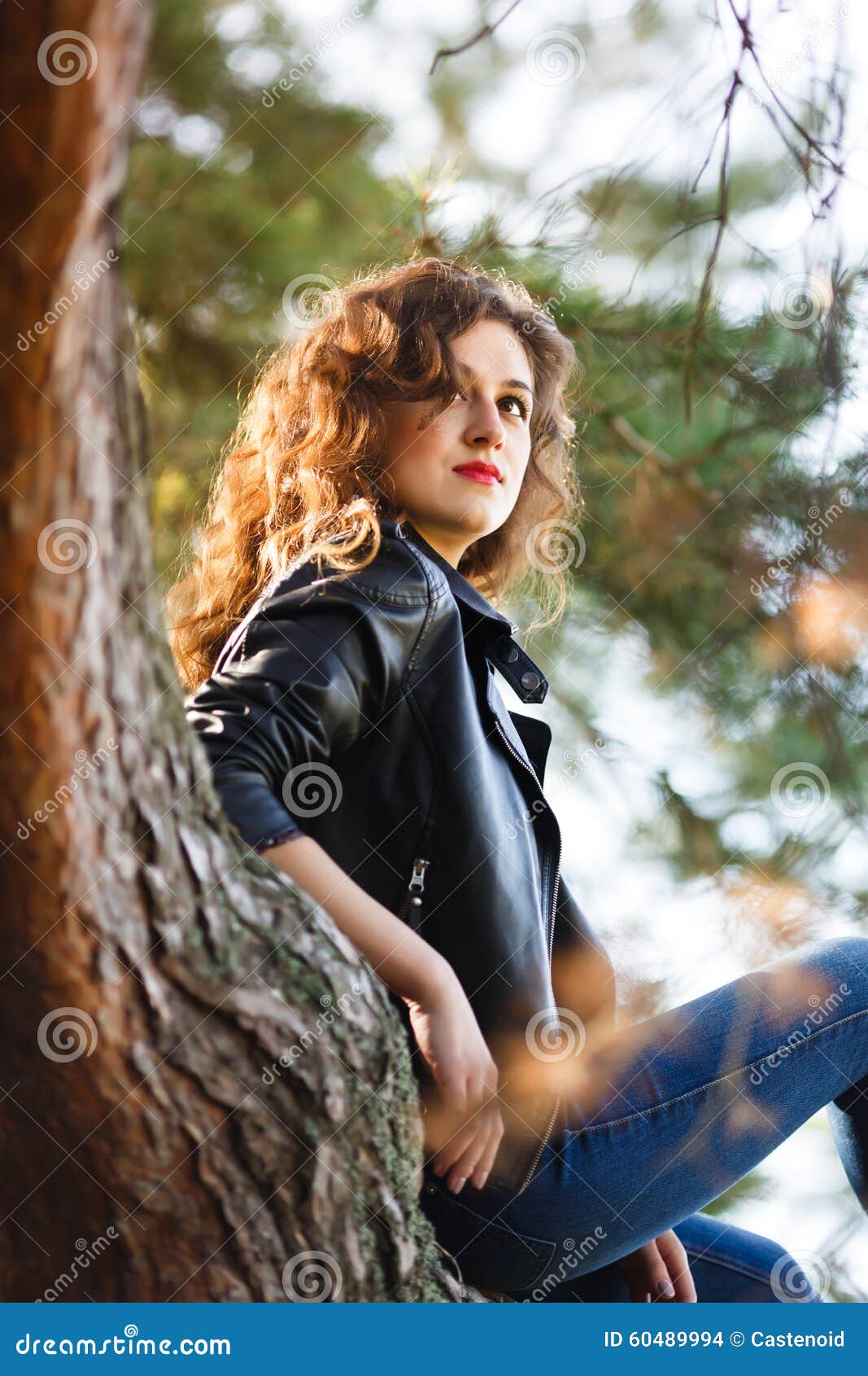 Young Woman Sitting on a Tree Stock Photo - Image of pretty, beautiful ...