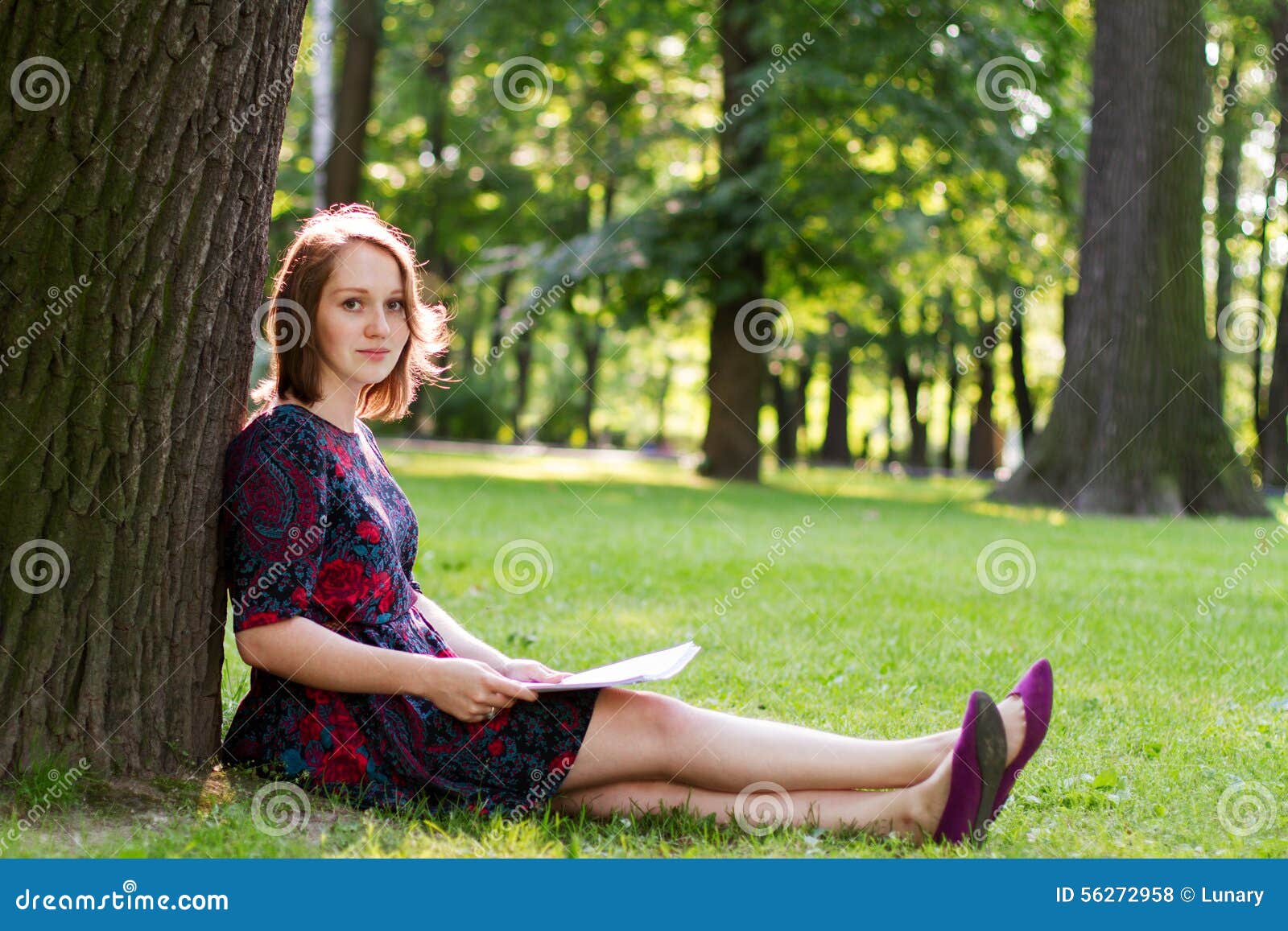 Young Woman Sitting Under a Tree Stock Photo - Image of people ...