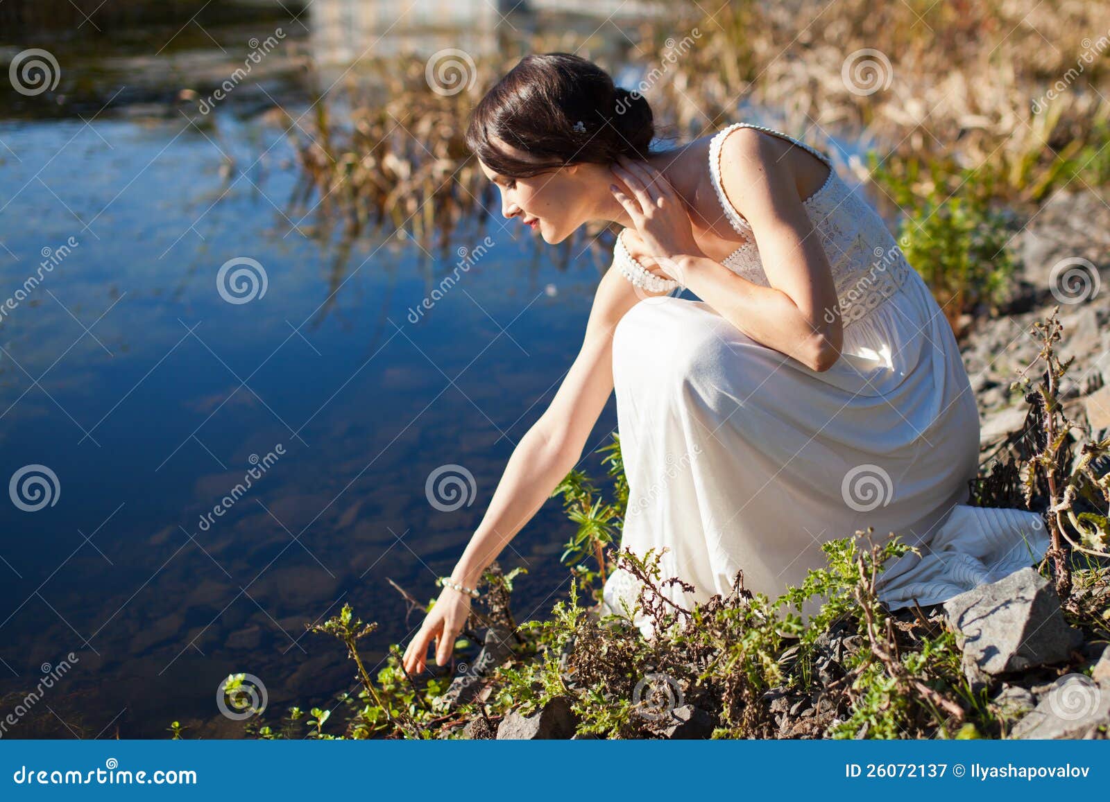 Young Woman Sitting by Water Stock Image - Image of beauty, caucasian ...