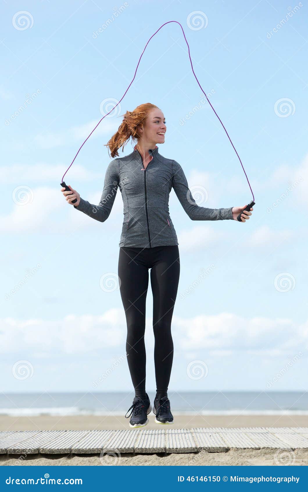 Young Woman Skipping with Jump Rope Outdoors Stock Photo - Image of ...