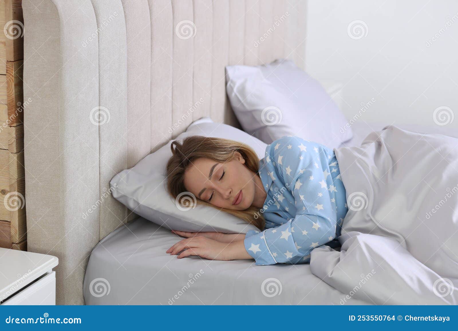 Young Woman Sleeping in Comfortable Bed with Silky Linens Stock Photo ...