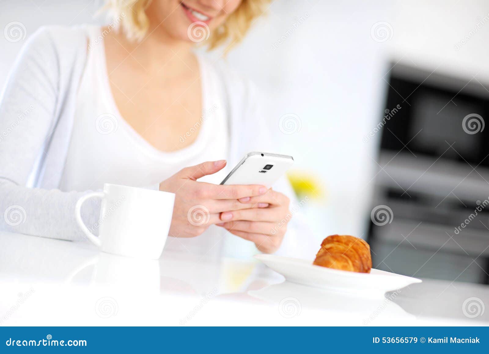 Young Woman with Smartphone in the Kitchen Stock Image - Image of ...