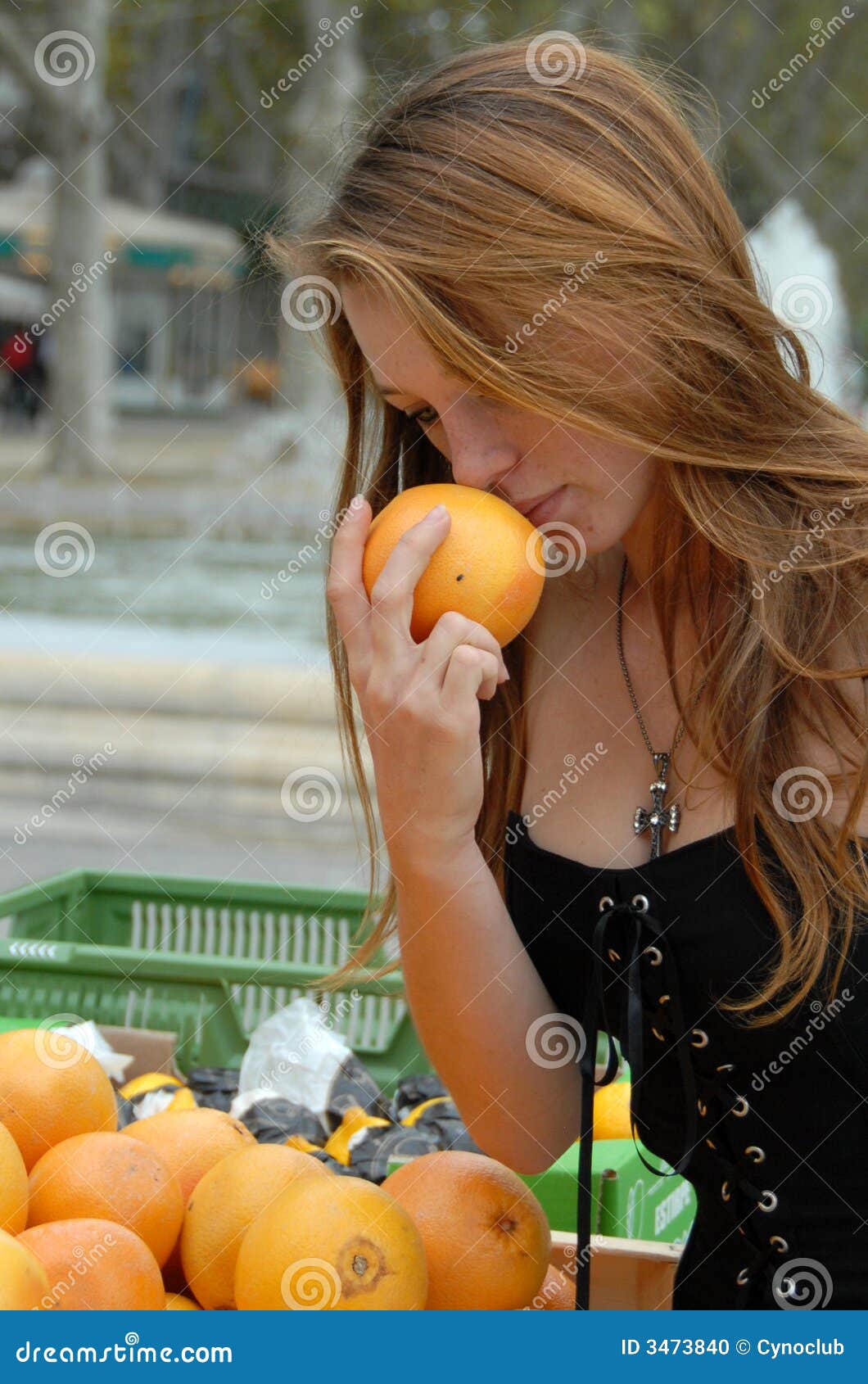 Young woman smell a fruit stock photo. Image of pretty - 3473840