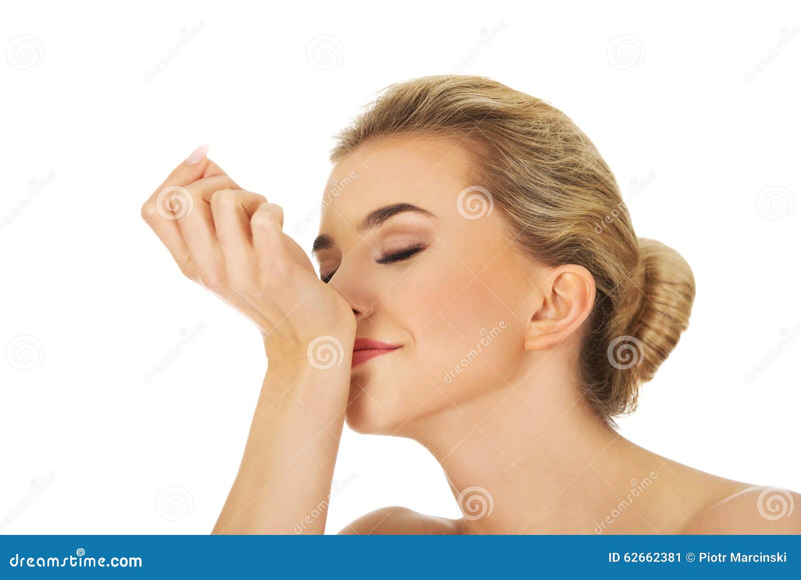 Young Woman Smelling Perfume on Her Wrist. Stock Image - Image of ...