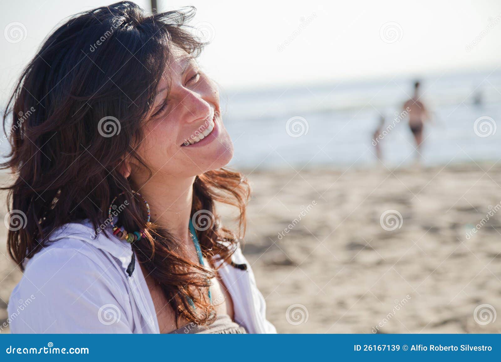 Young Woman Smiling on Beach Stock Image - Image of serenity, costume ...
