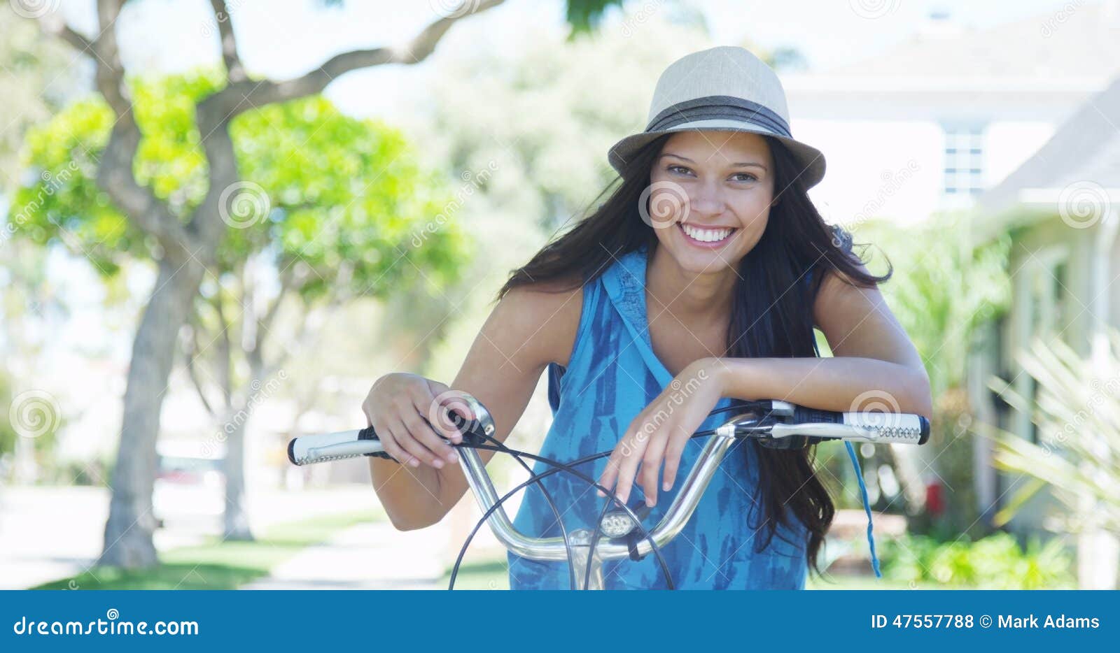 Young Woman Smiling on Bike Stock Photo - Image of happiness, happy ...