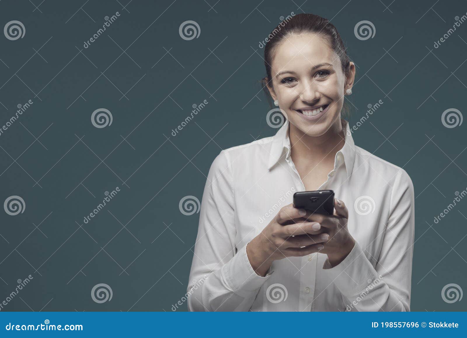 Smiling Young Woman Connecting with Her Smartphone Stock Photo - Image ... Smiling Young Woman Connecting with Her Smartphone Stock Photo - Image ...