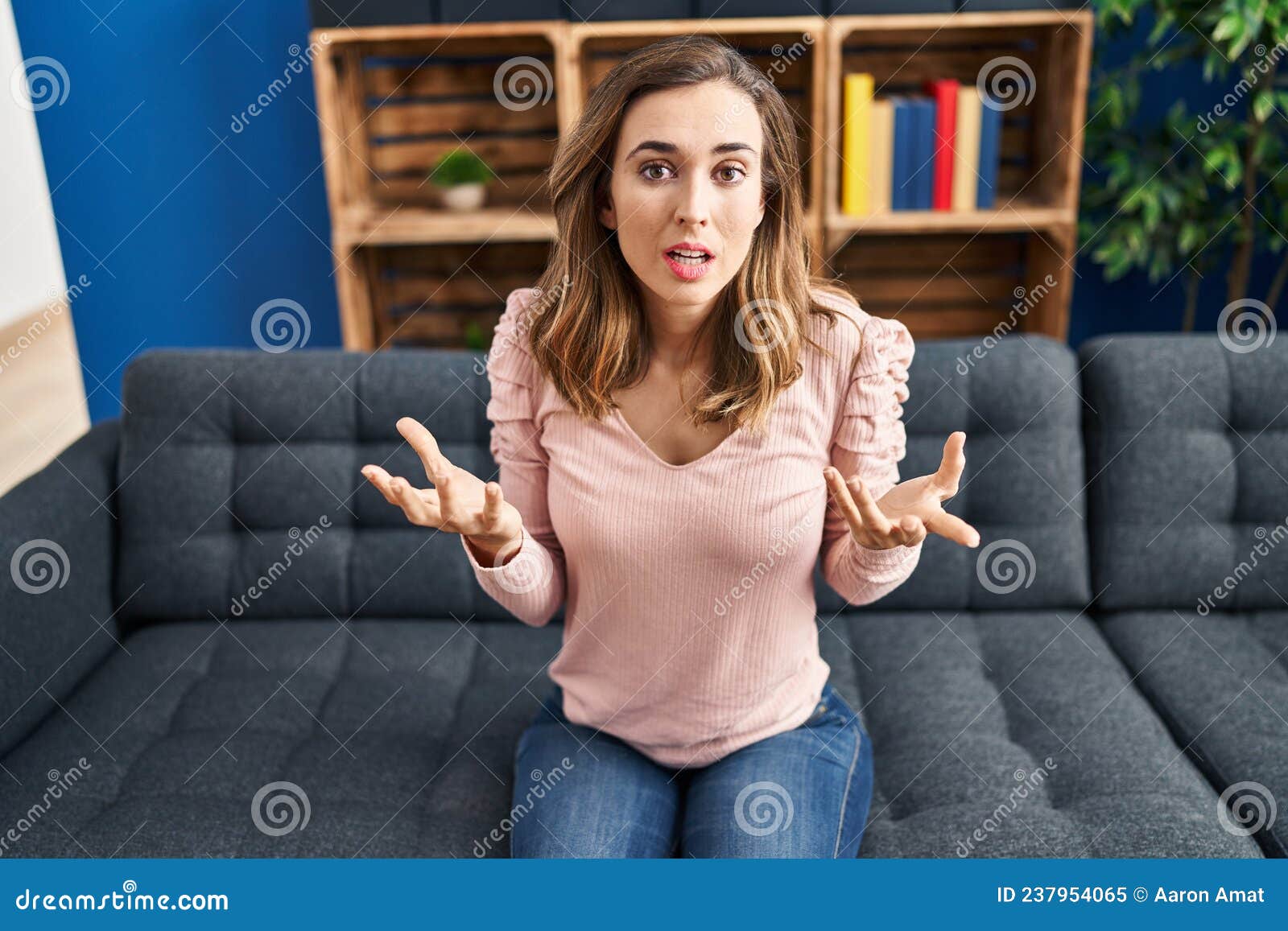 Young Woman Smiling Confident Sitting on Sofa at Home Stock Image ...